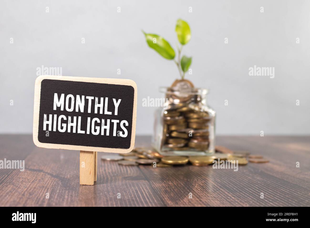 Torn brown paper with the inscription Monthly Highlights on desk ...
