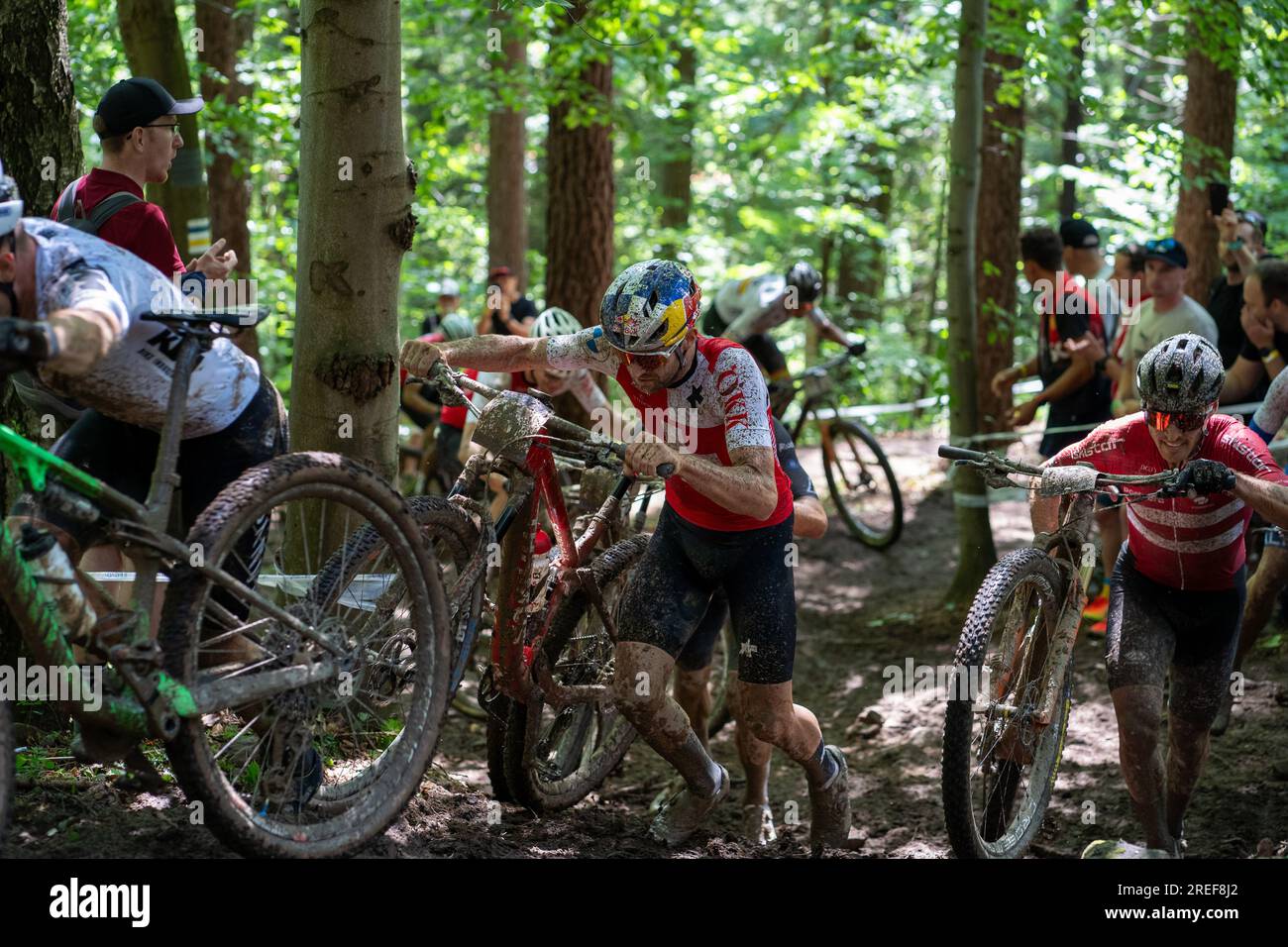 Lars Forster and Sebastian Fini push bikes on steep uphill - 2023 UEC ...