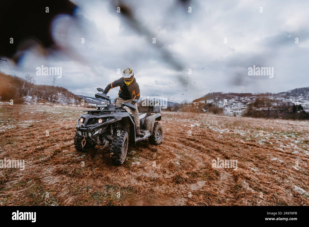 A man is fearlessly enjoying an adventurous ride on an ATV Quad through ...