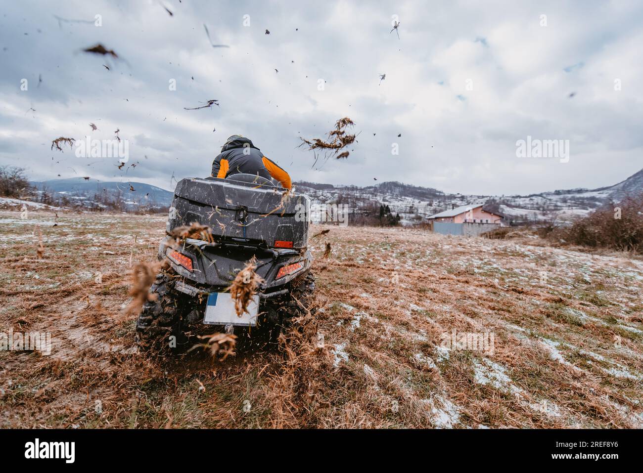 A man is fearlessly enjoying an adventurous ride on an ATV Quad through ...