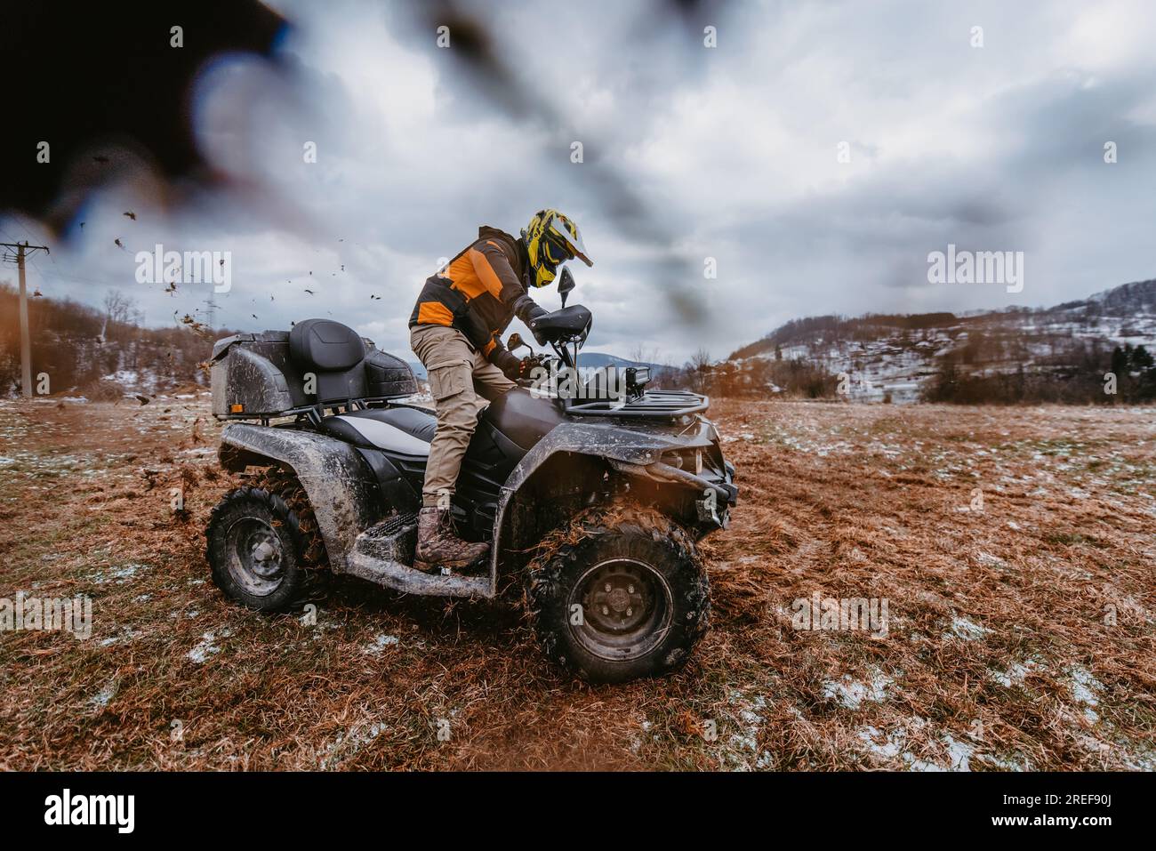 A man is fearlessly enjoying an adventurous ride on an ATV Quad through ...