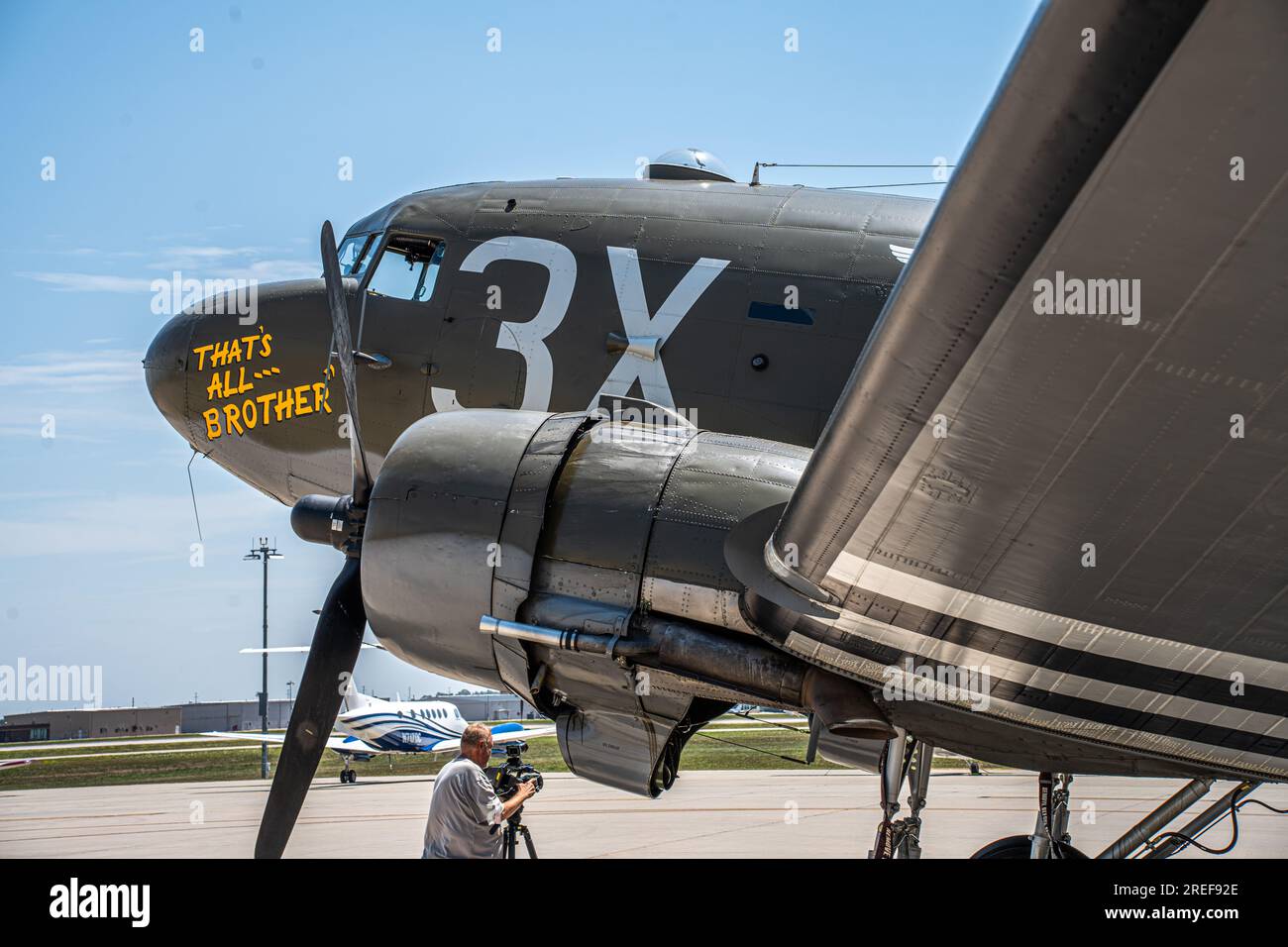 The Douglas C-47 Skytrain waits on the flight line to board passengers ...