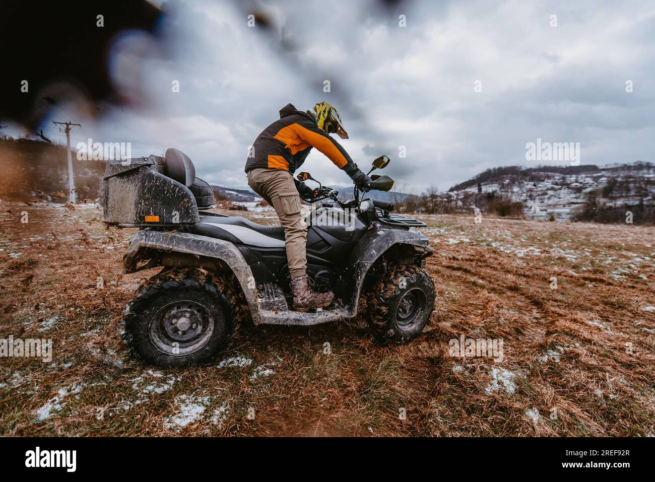 A man is fearlessly enjoying an adventurous ride on an ATV Quad through ...