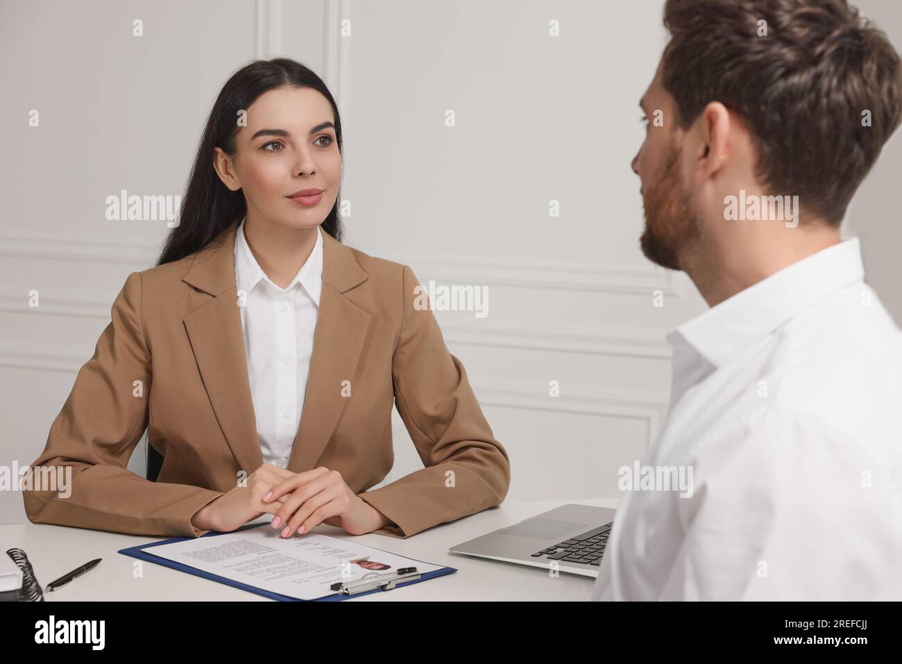 Human resources manager conducting job interview with applicant in office Stock Photo - Alamy