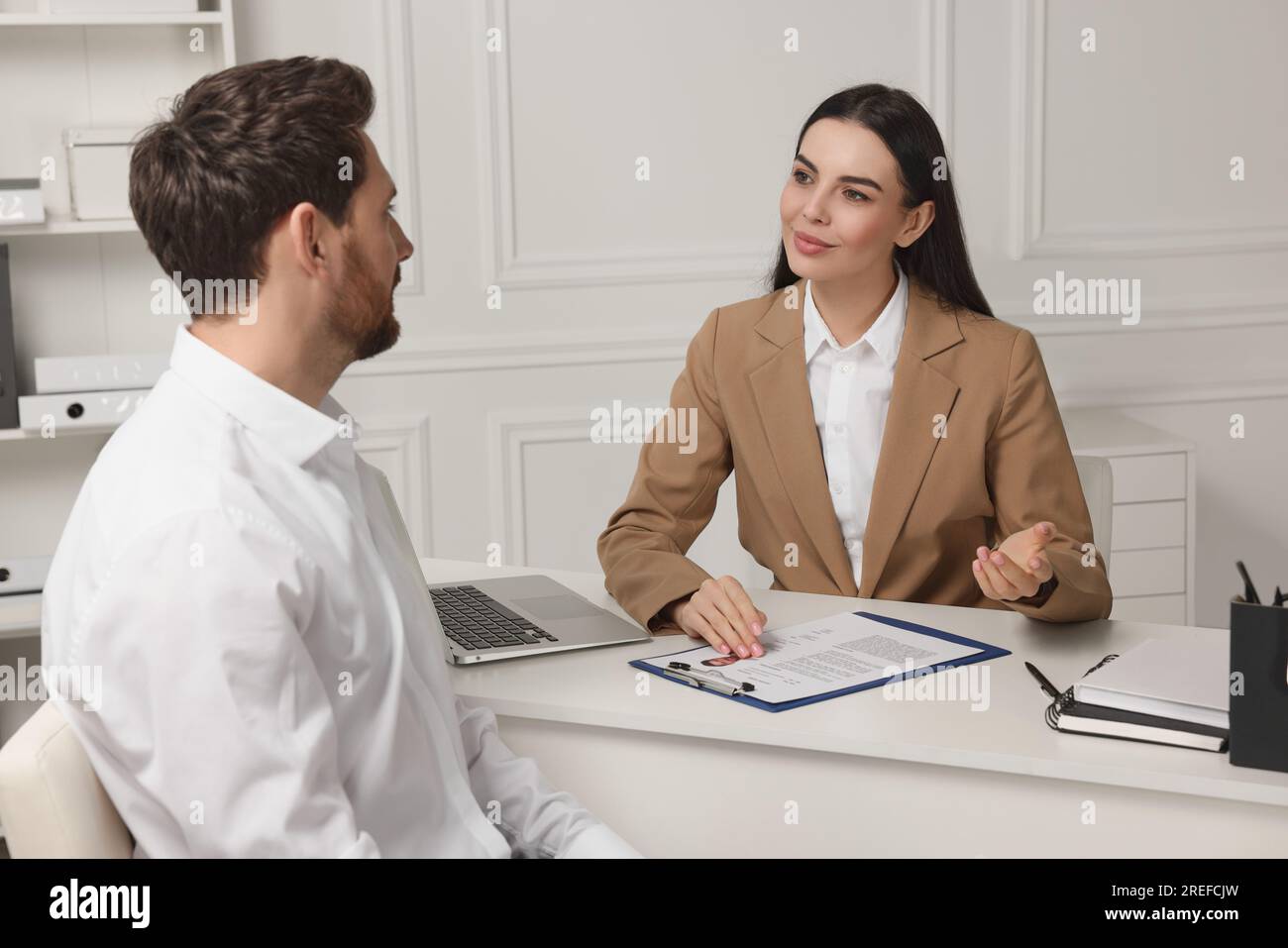 Human resources manager conducting job interview with applicant in office Stock Photo - Alamy