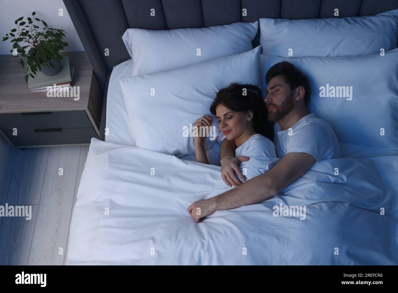 Couple sleeping in bed top view hi-res stock photography and images - Alamy