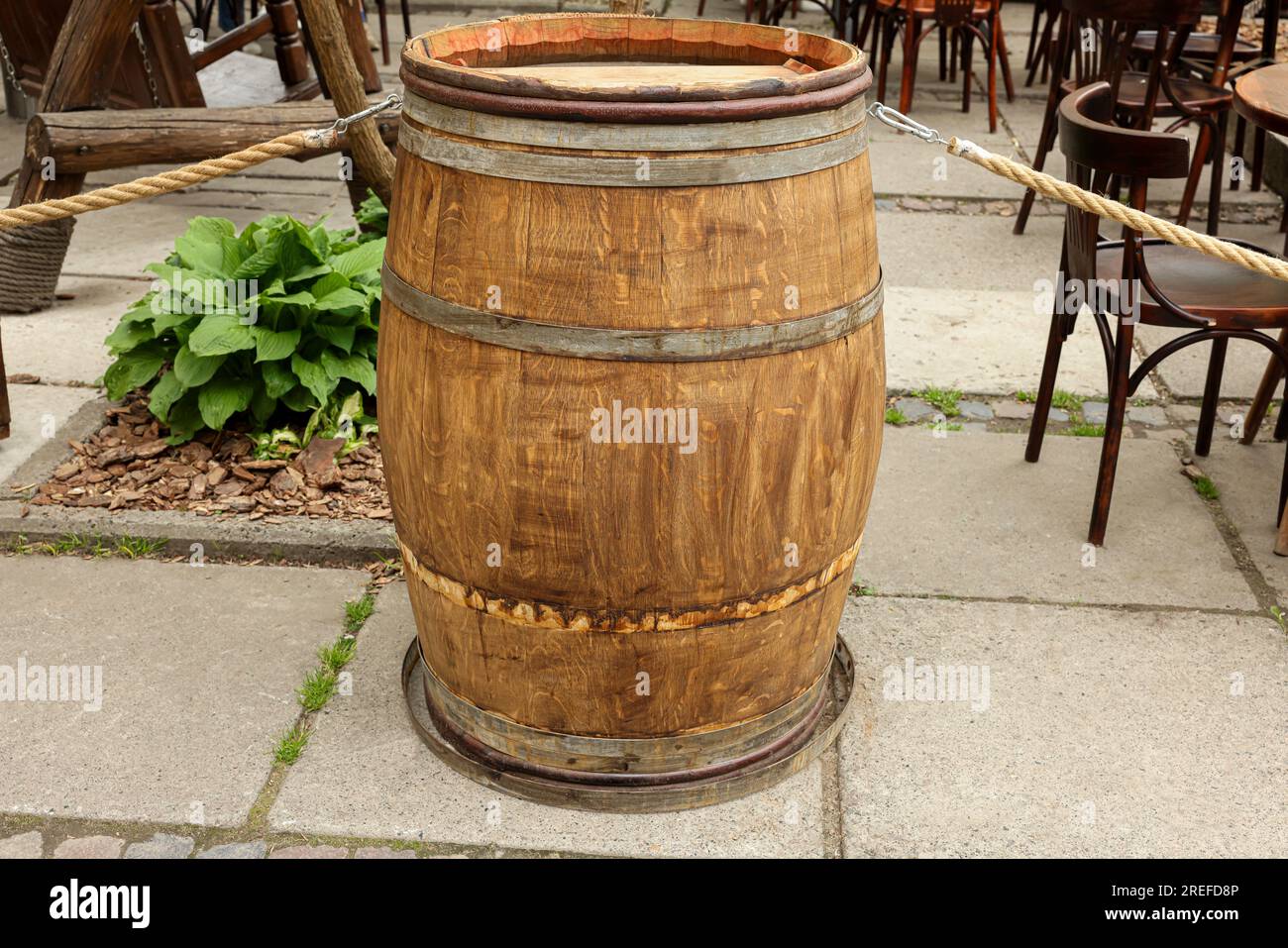 Traditional wooden barrel on street outdoors. Wine making Stock Photo ...