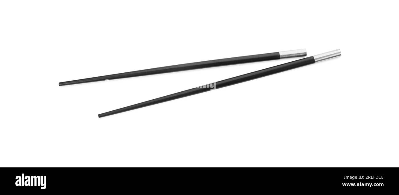 Pair of black chopsticks isolated on white Stock Photo - Alamy