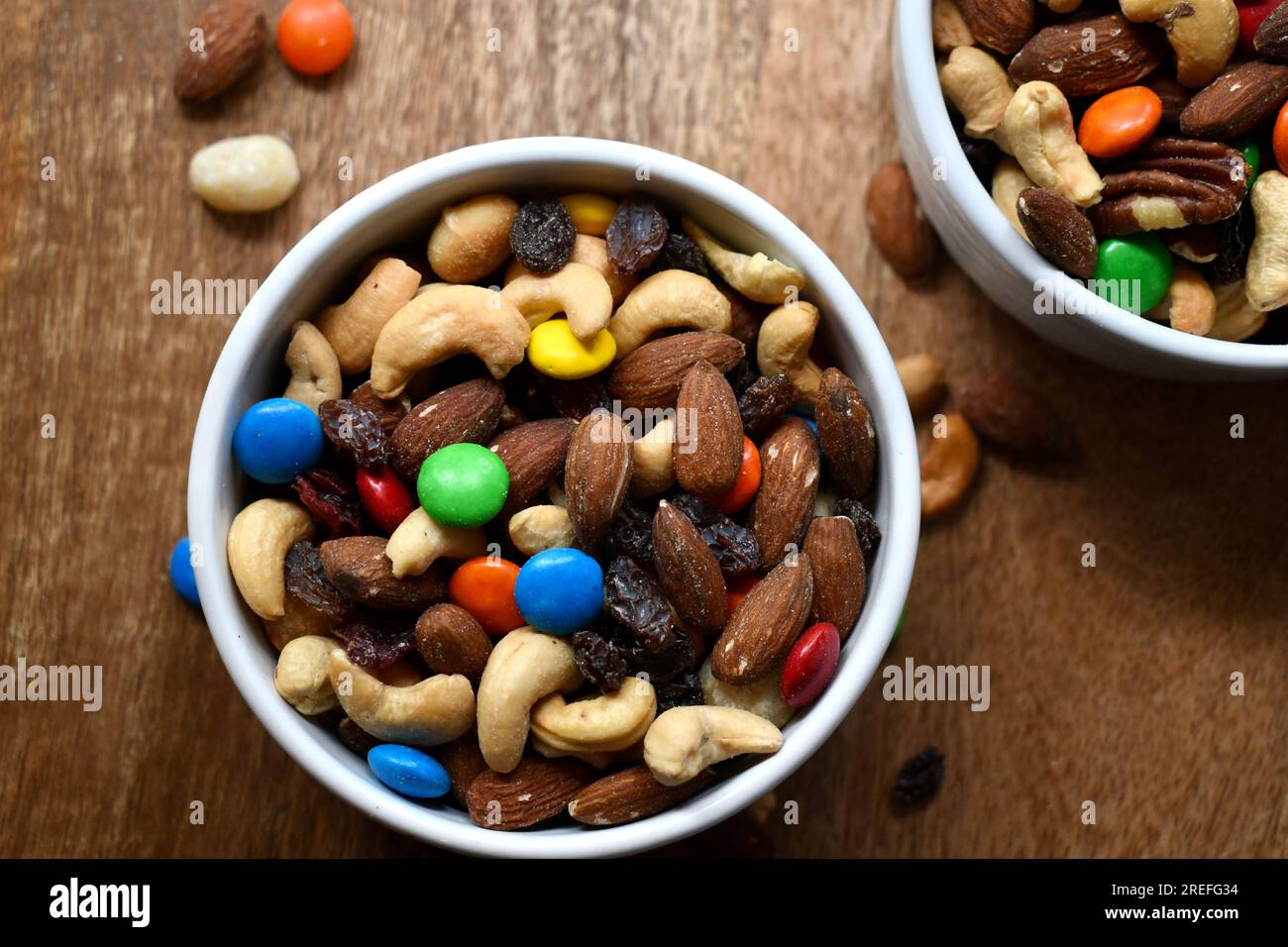 Colorful trail mix in a white bowl Stock Photo - Alamy