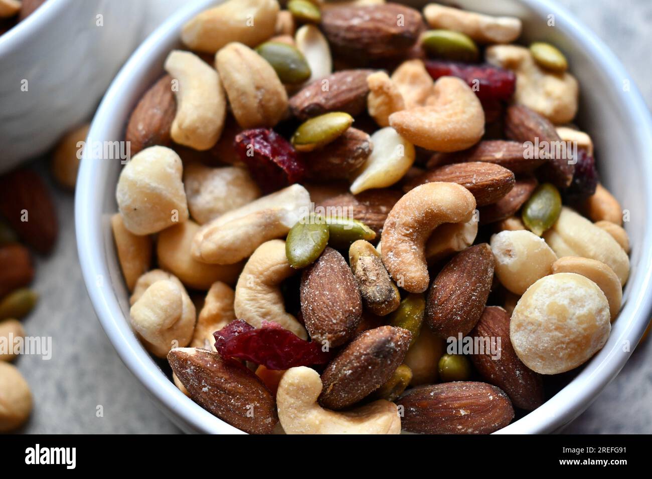Healthy trail mix in a white bowl Stock Photo - Alamy