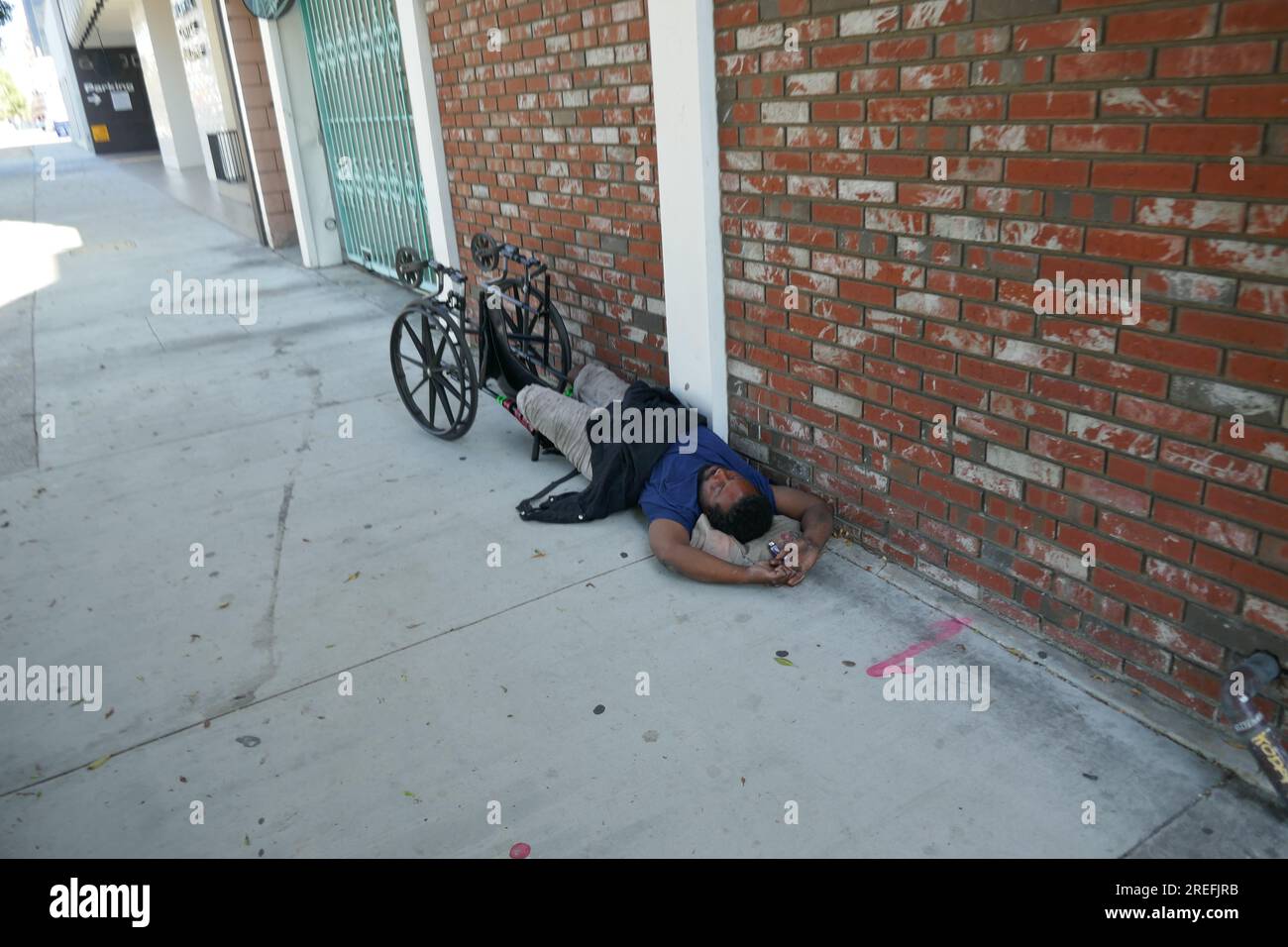 Los Angeles, California, USA 27th July 2023 Homeless man sleeping on ...