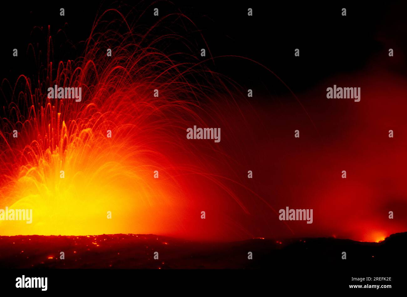 Lava explodes into a fountain of yellow and red in Hawaii Volcanoes ...