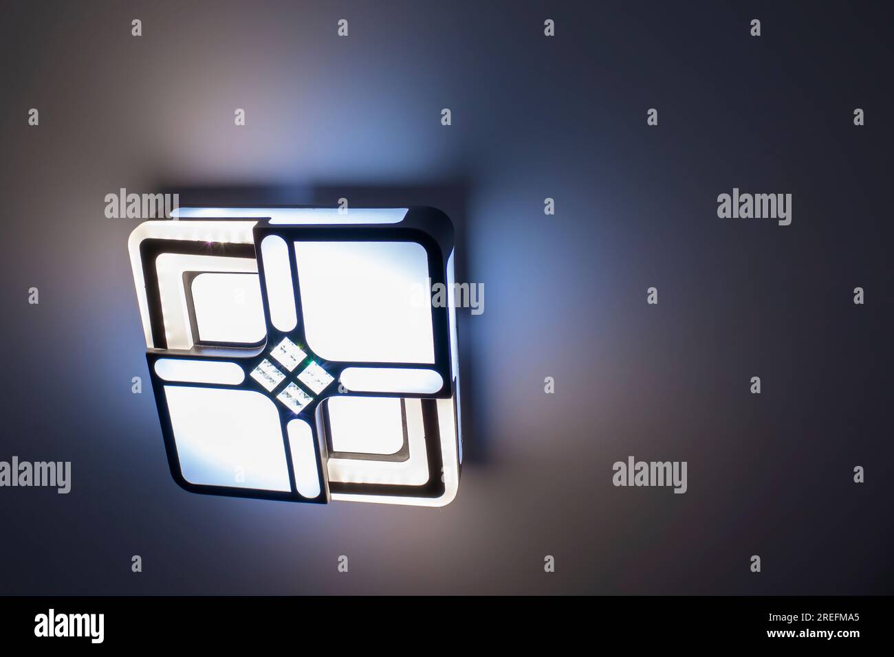 Modern LED Ceiling Chandelier with Control Panel. Adjusting the ...