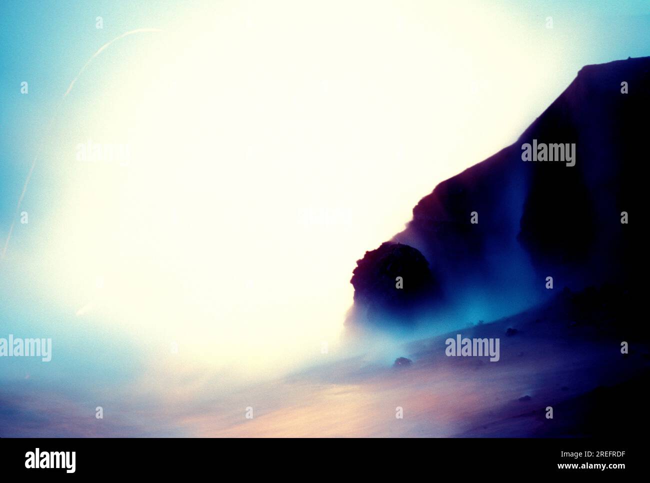 Lava enters the ocean creating an explosion of steam at Volcanoes ...