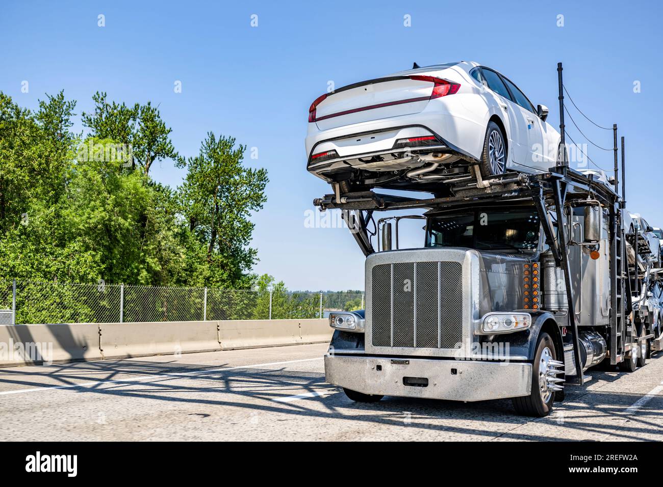 Industrial big rig car hauler semi truck tractor transporting fastened ...