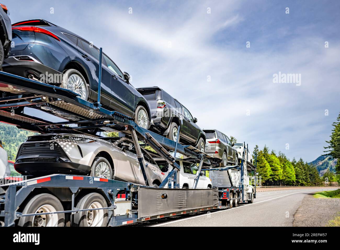 Industrial big rig car hauler semi truck tractor transporting fastened ...