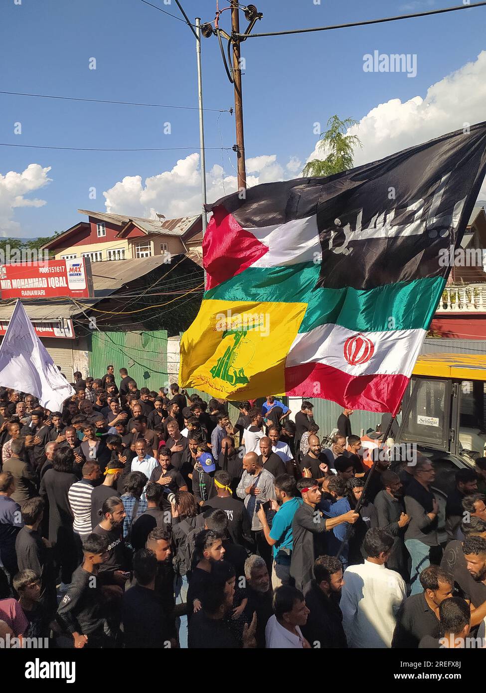 Shia muslims unfurling flags during muharram Procession Stock Photo - Alamy