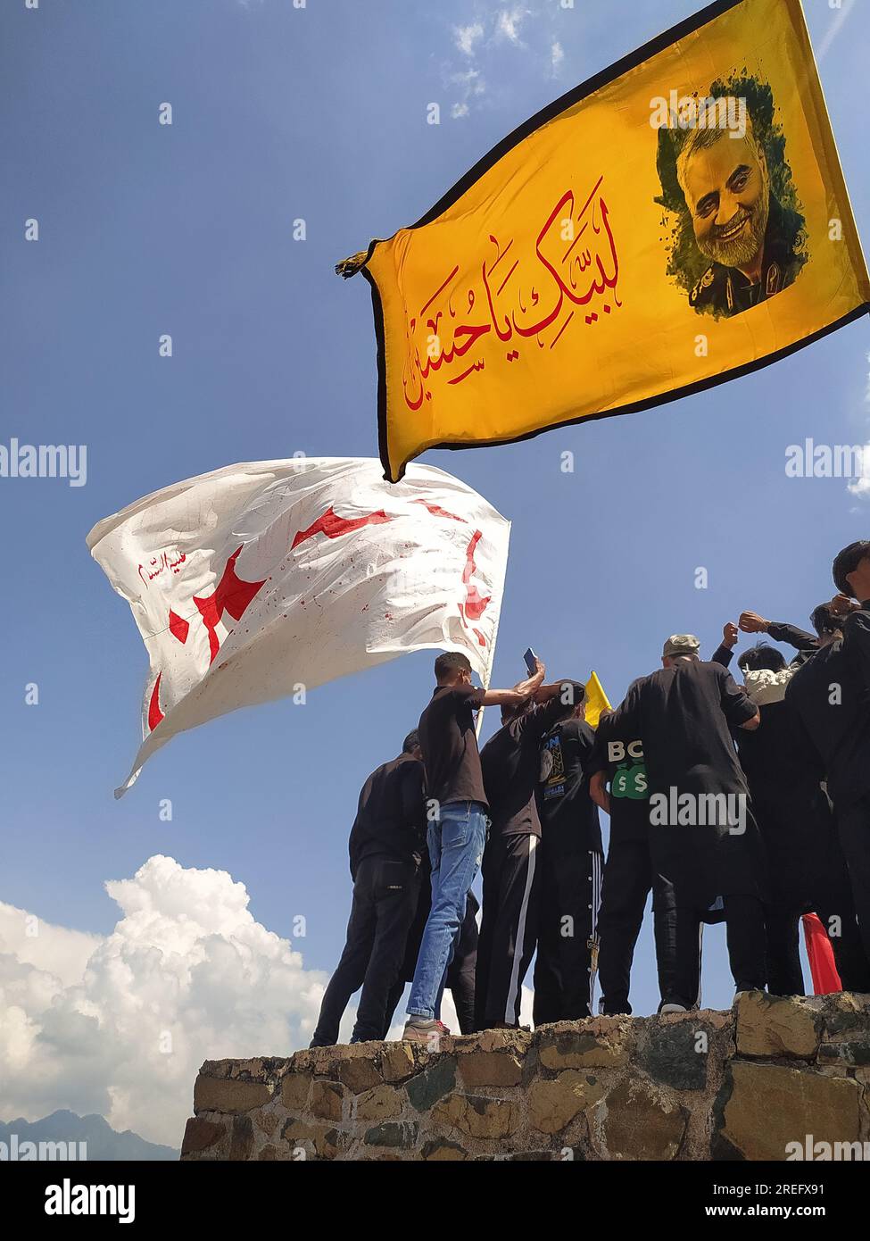Shia muslims unfurling flags during muharram Procession Stock Photo - Alamy