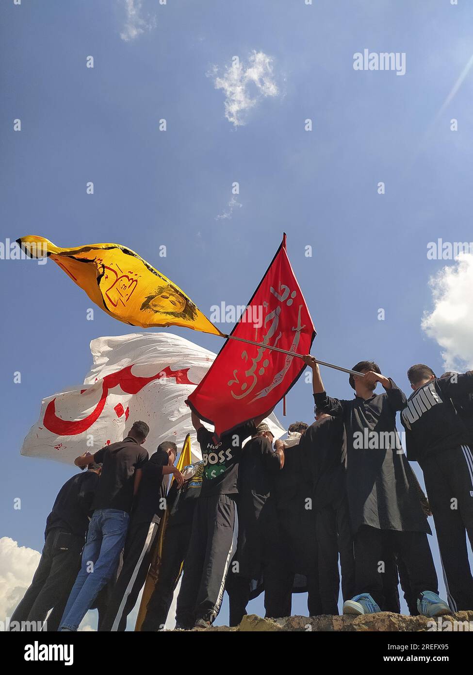 Shia muslims unfurling flags during muharram Procession Stock Photo - Alamy