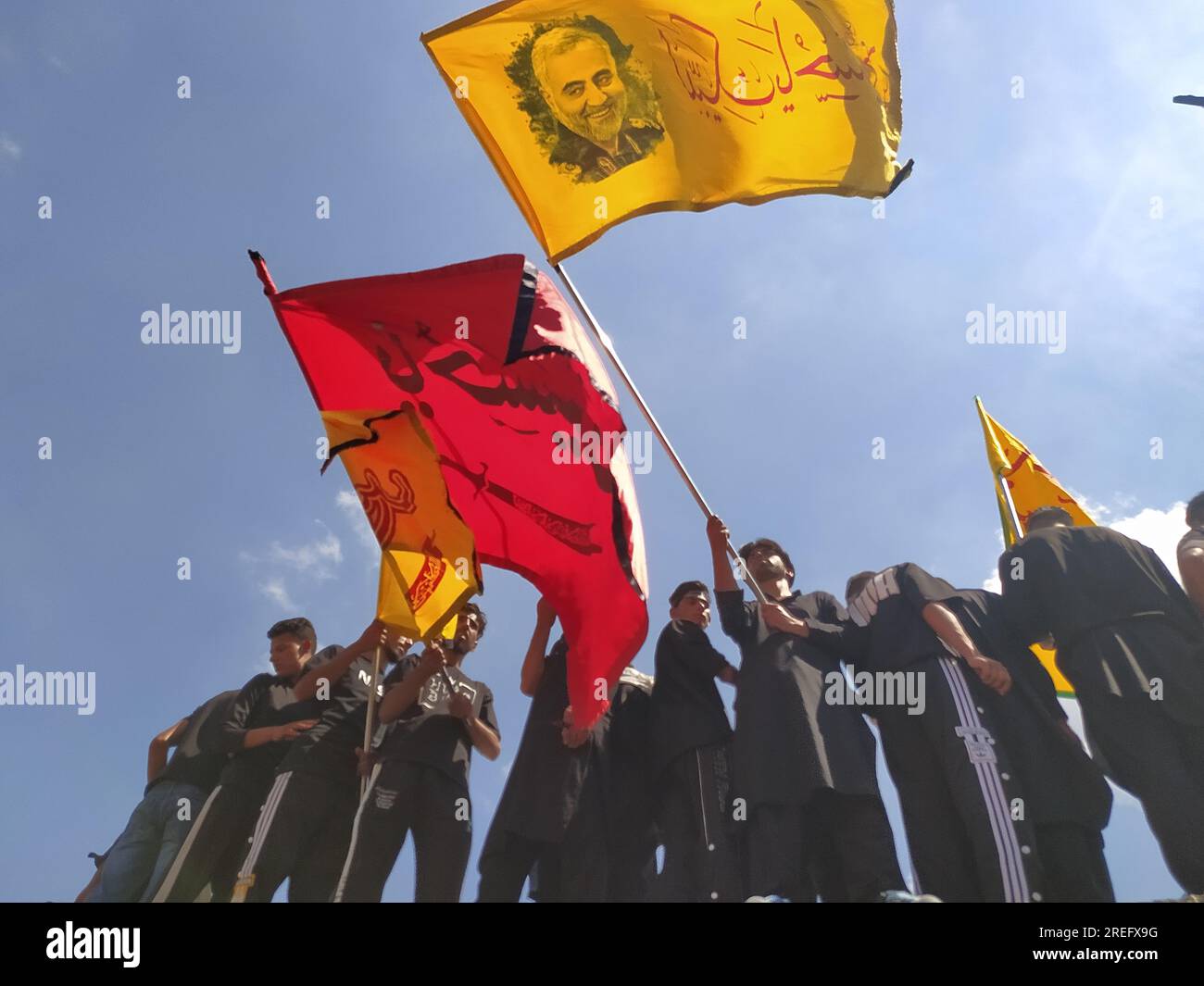 Shia muslims unfurling flags during muharram Procession Stock Photo - Alamy