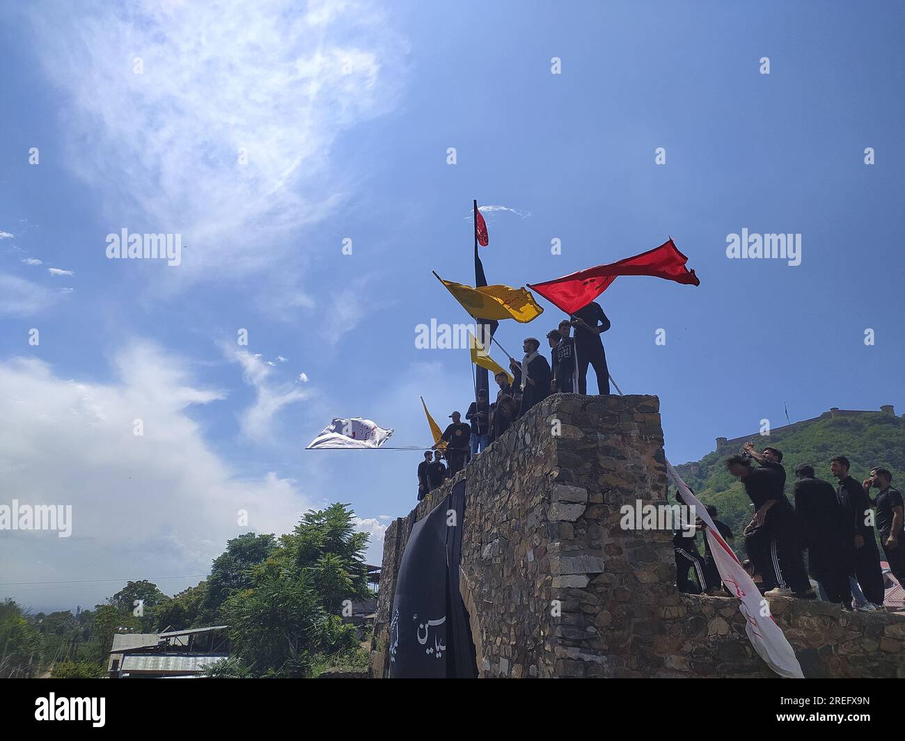 Shia muslims unfurling flags during muharram Procession Stock Photo - Alamy