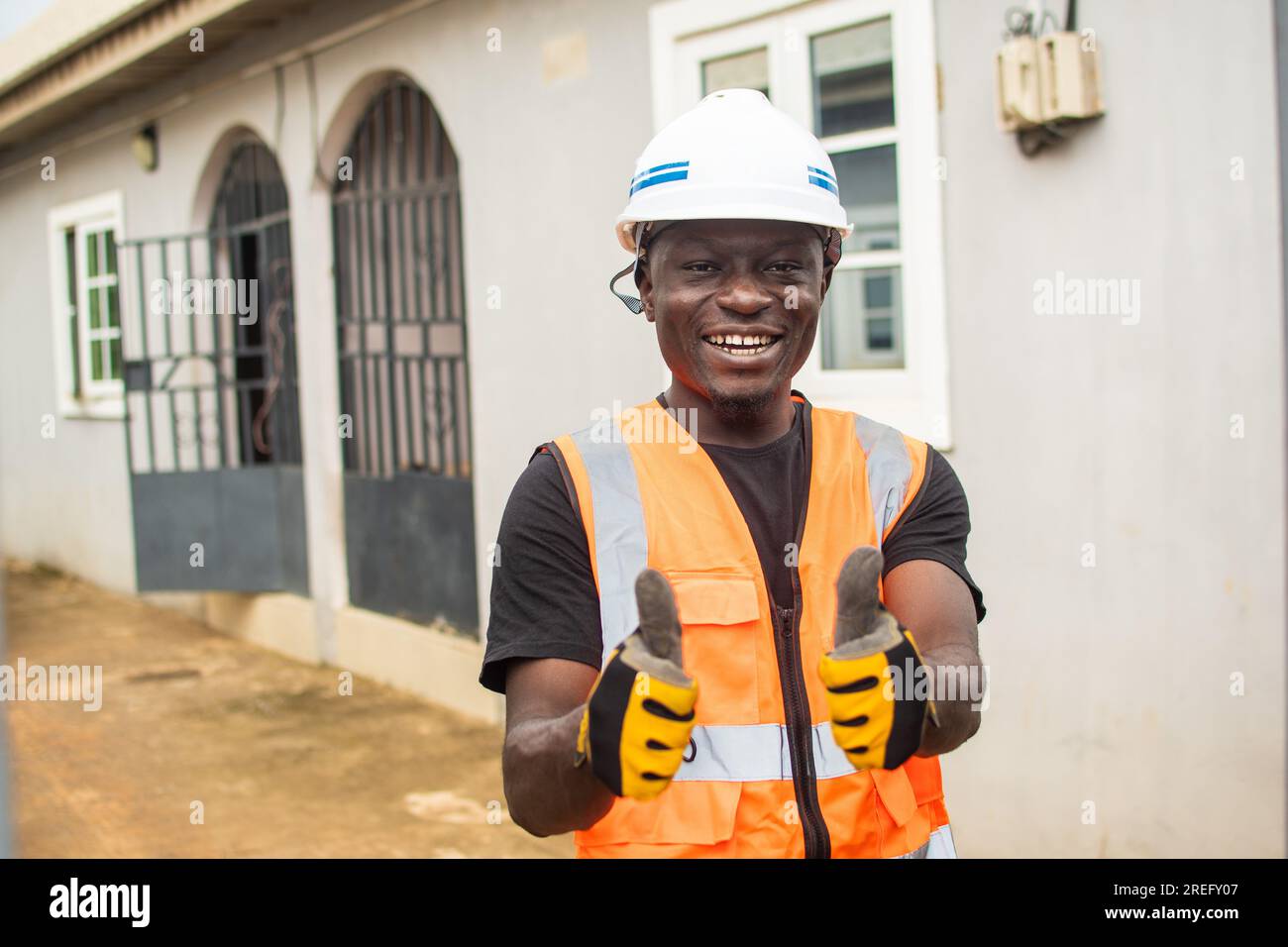 excited young african engineer doing thumbs up gesture Stock Photo - Alamy