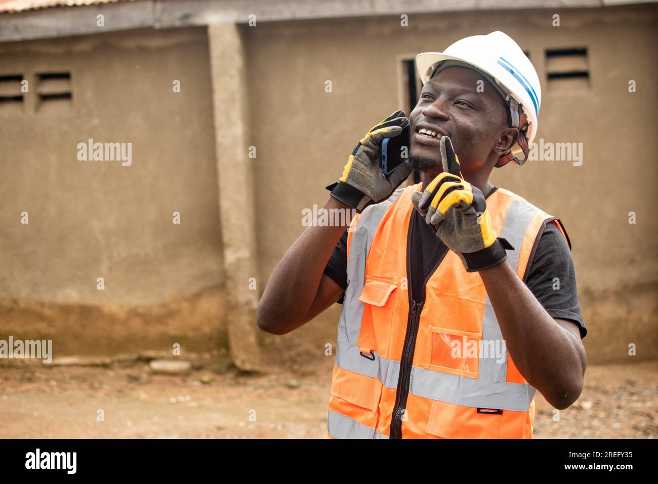 african engineer making a phone call Stock Photo - Alamy
