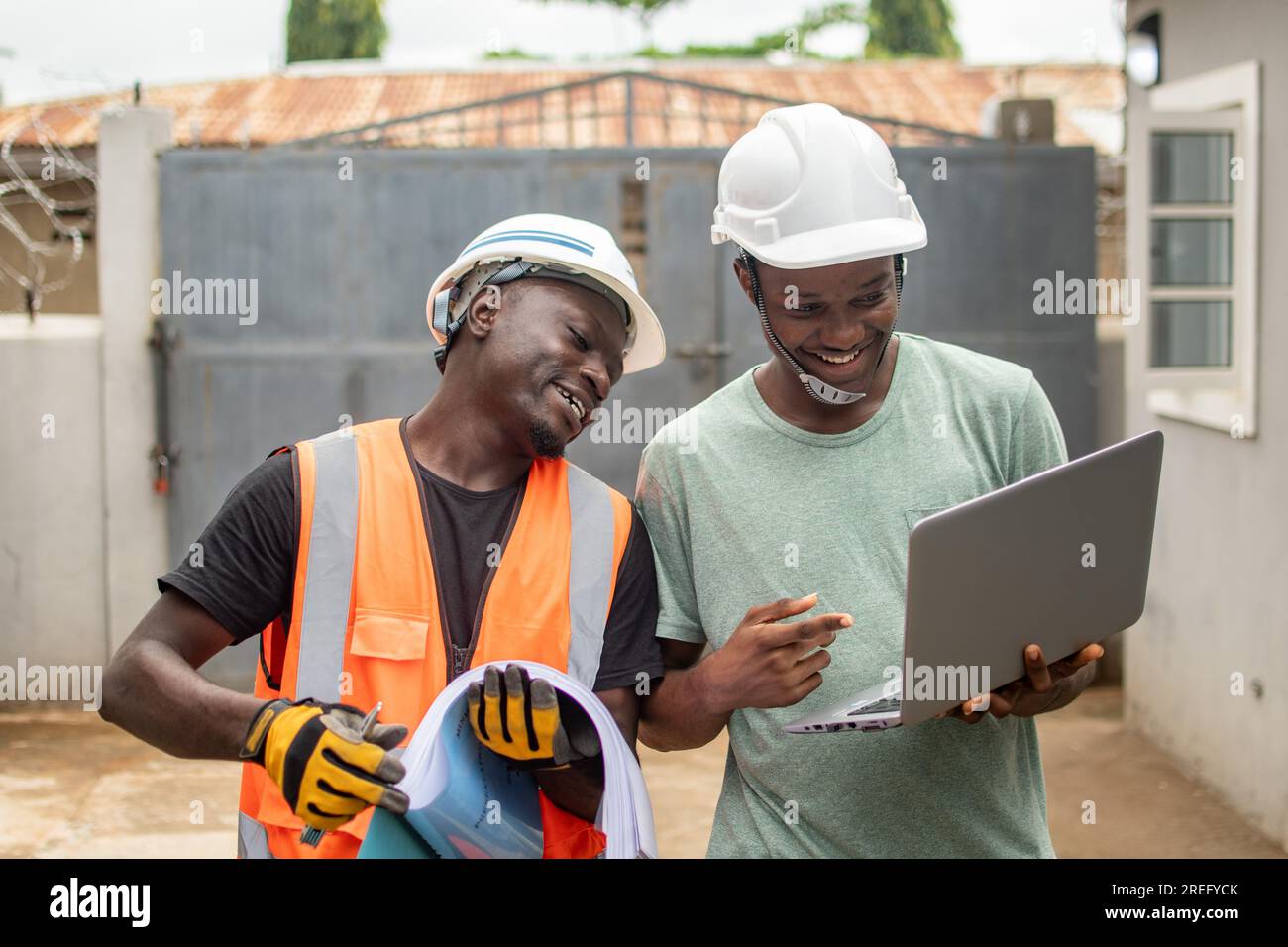 two african engineers working using a laptop Stock Photo - Alamy