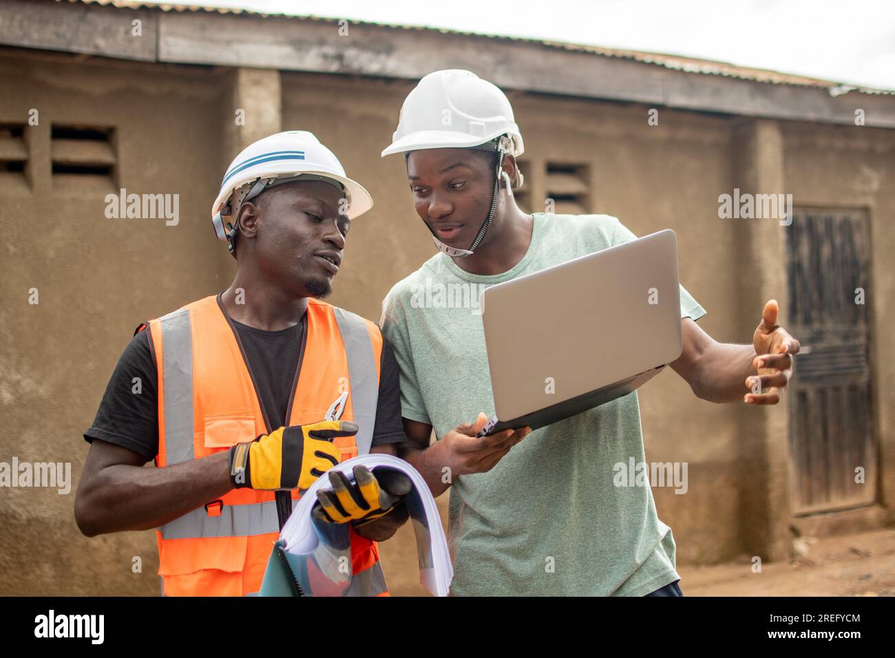 two african engineers working with a laptop Stock Photo - Alamy