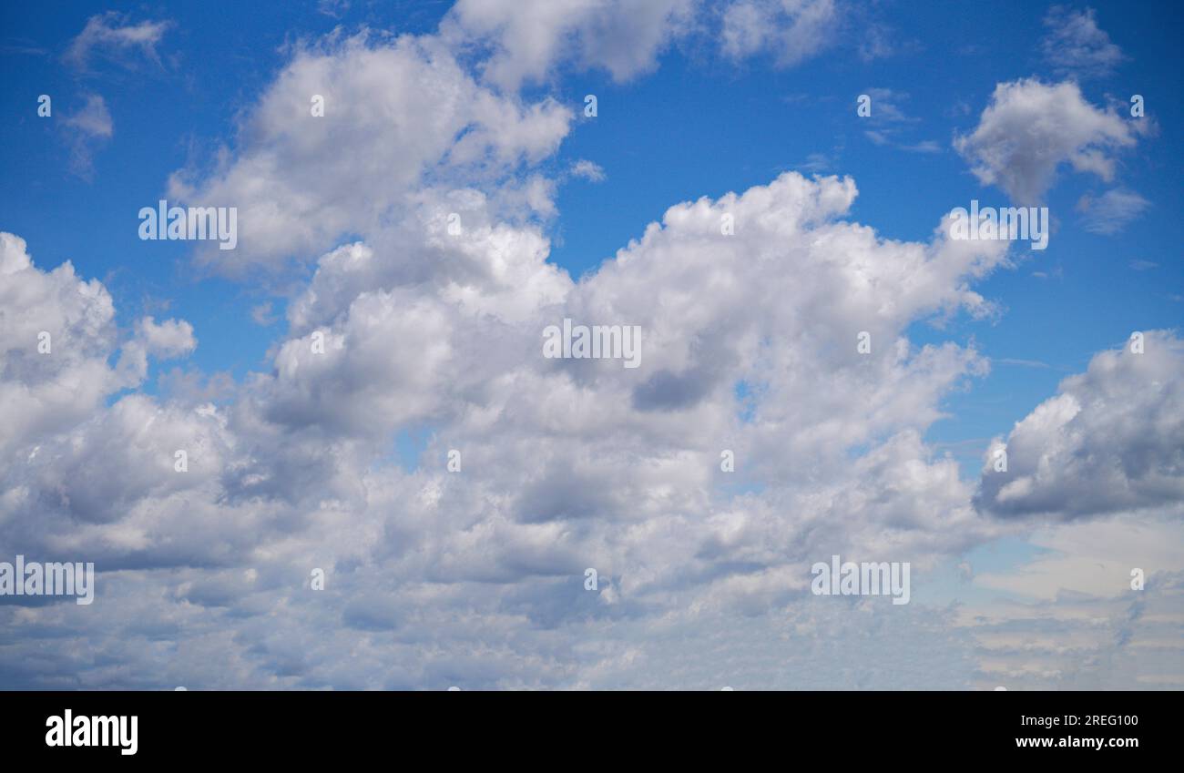 Stratus cumulus alto nimbo clouds in the blue sky are weather messengers Stock Photo - Alamy