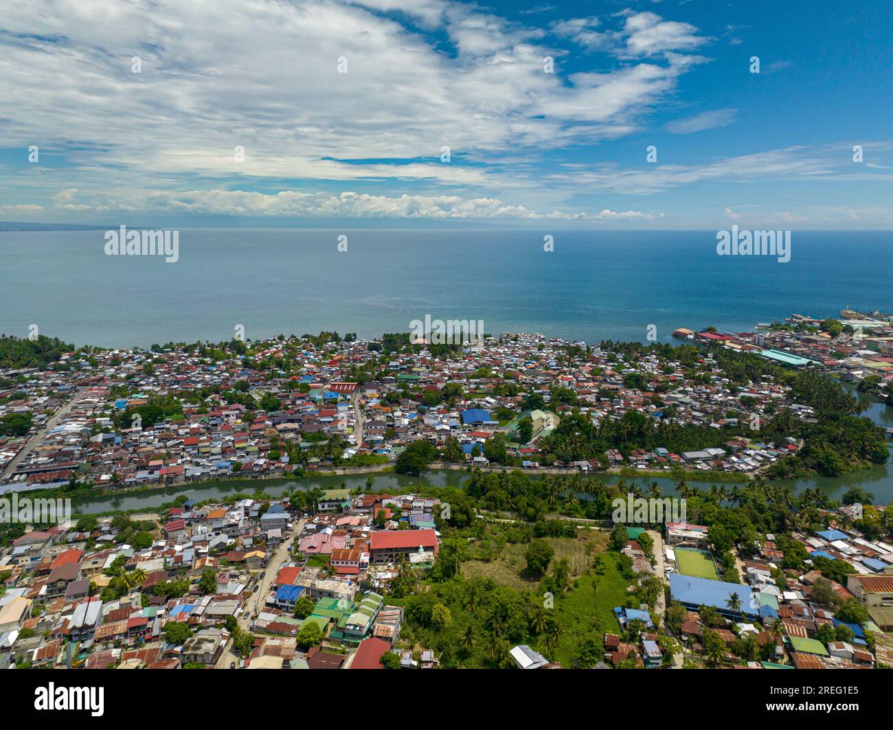 Iligan City: Busy city in daytime, residential area and commercial ...