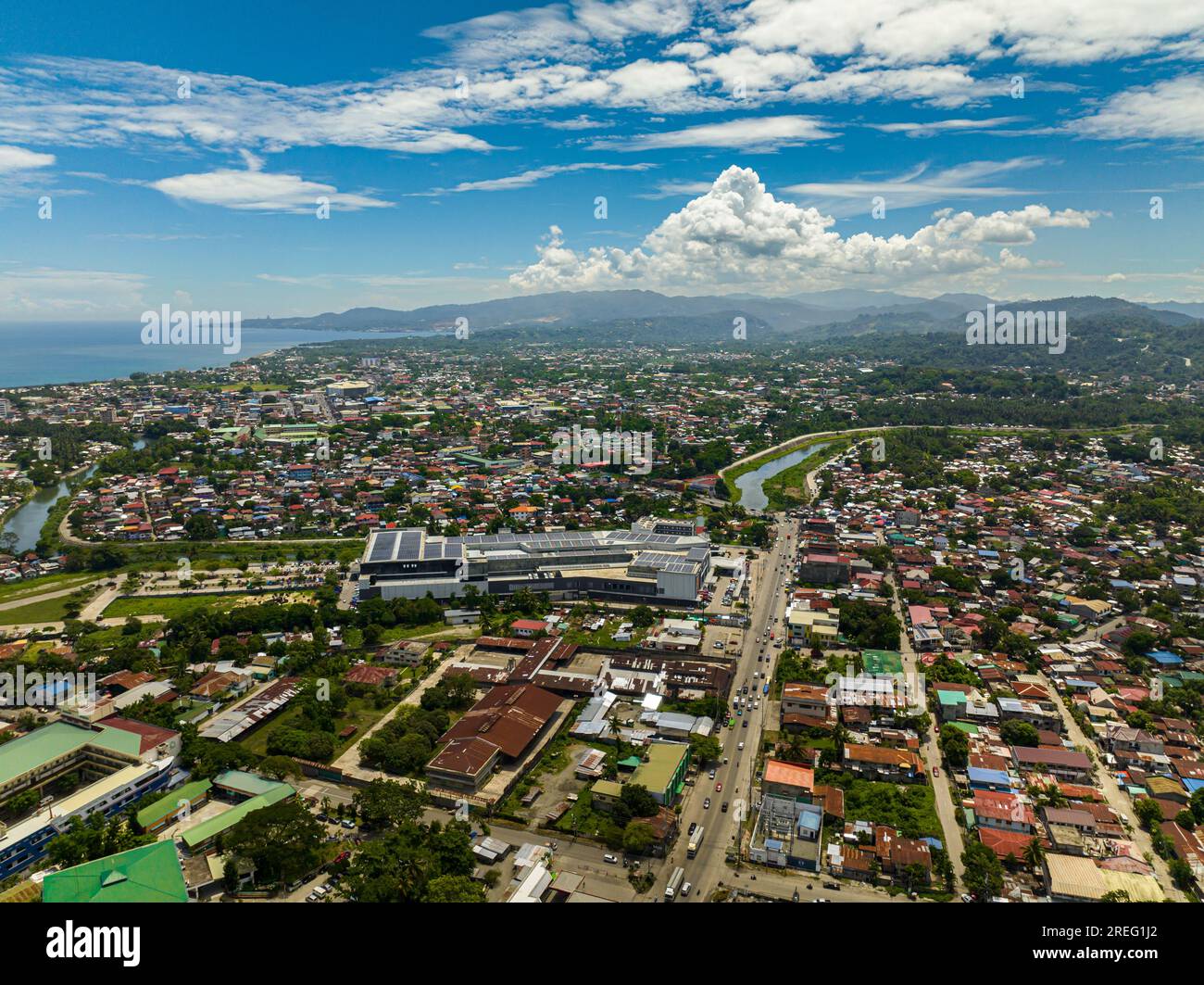 Aerial survey of Iligan City with modern and commercial buildings ...
