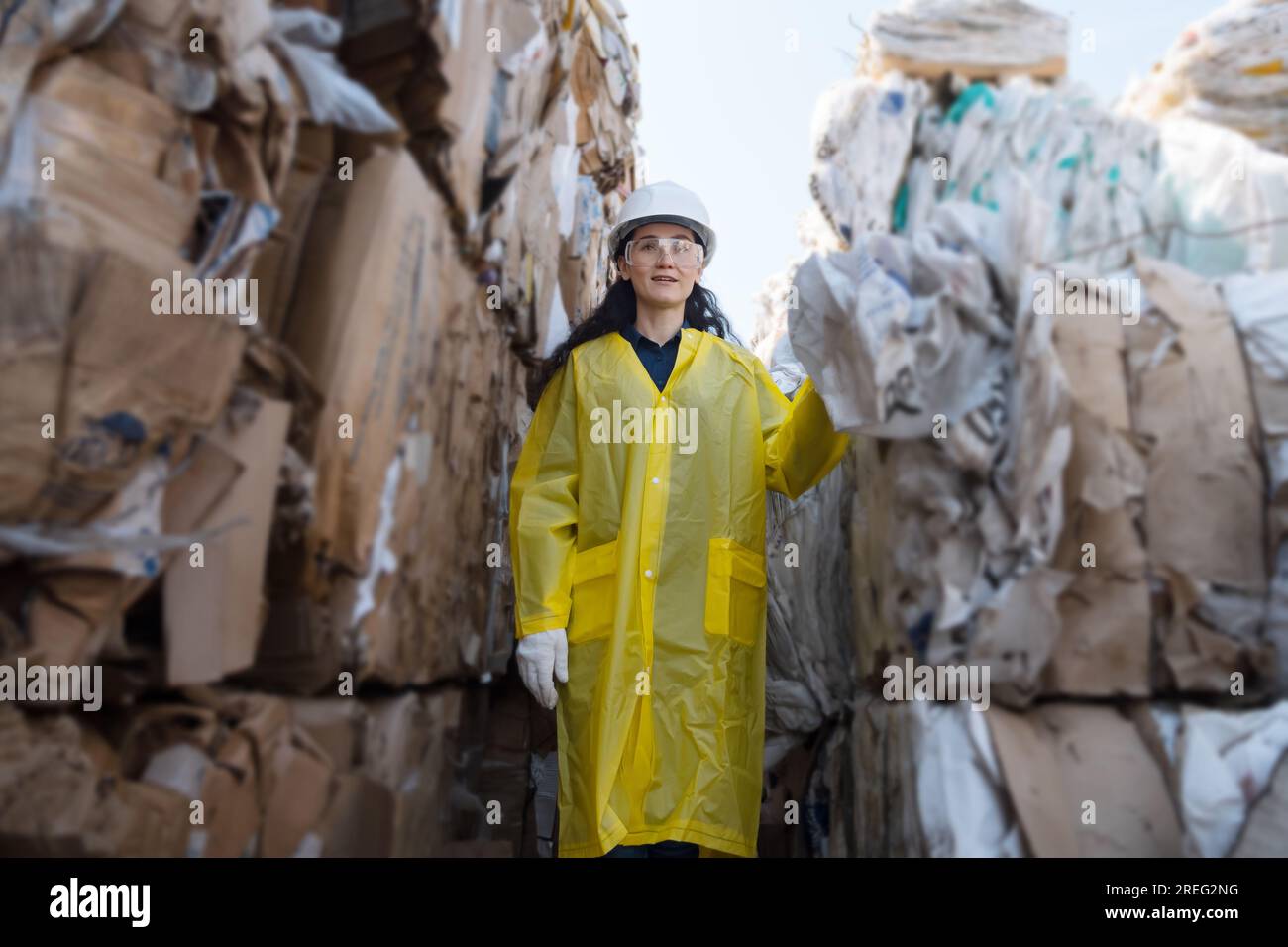Lady supervisor checks operations in workshop of waste plant Stock ...