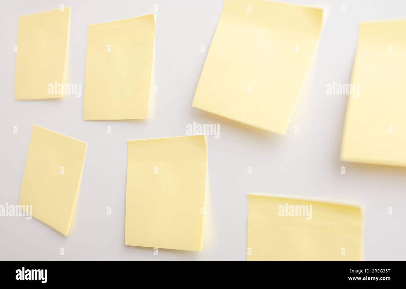 Set of blank yellow sticky notes. Business people meeting and use post ...