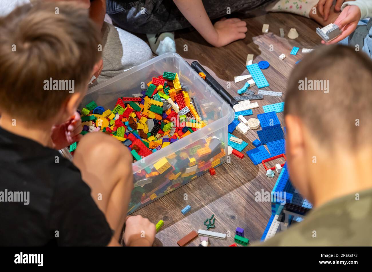 Children playing building something from blocks Stock Photo - Alamy