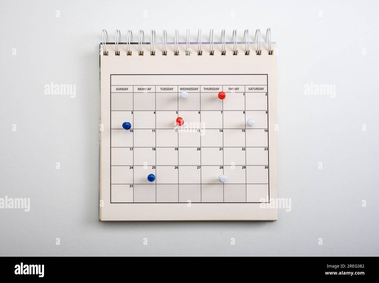 Scheduling and planning concept, calendar with colorful pin on white ...