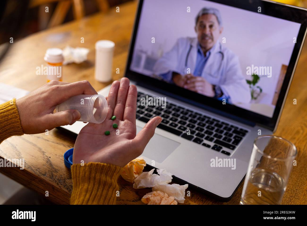 Indian man holding medication making video call using tablet at home ...