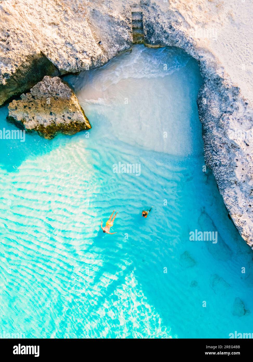 a couple of men and women on the beach of Tres Trap Aruba Caribbean ...