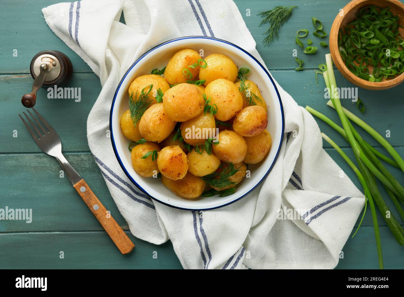Fresh boiled new or young potatoes with butter, fresh dill and onions ...