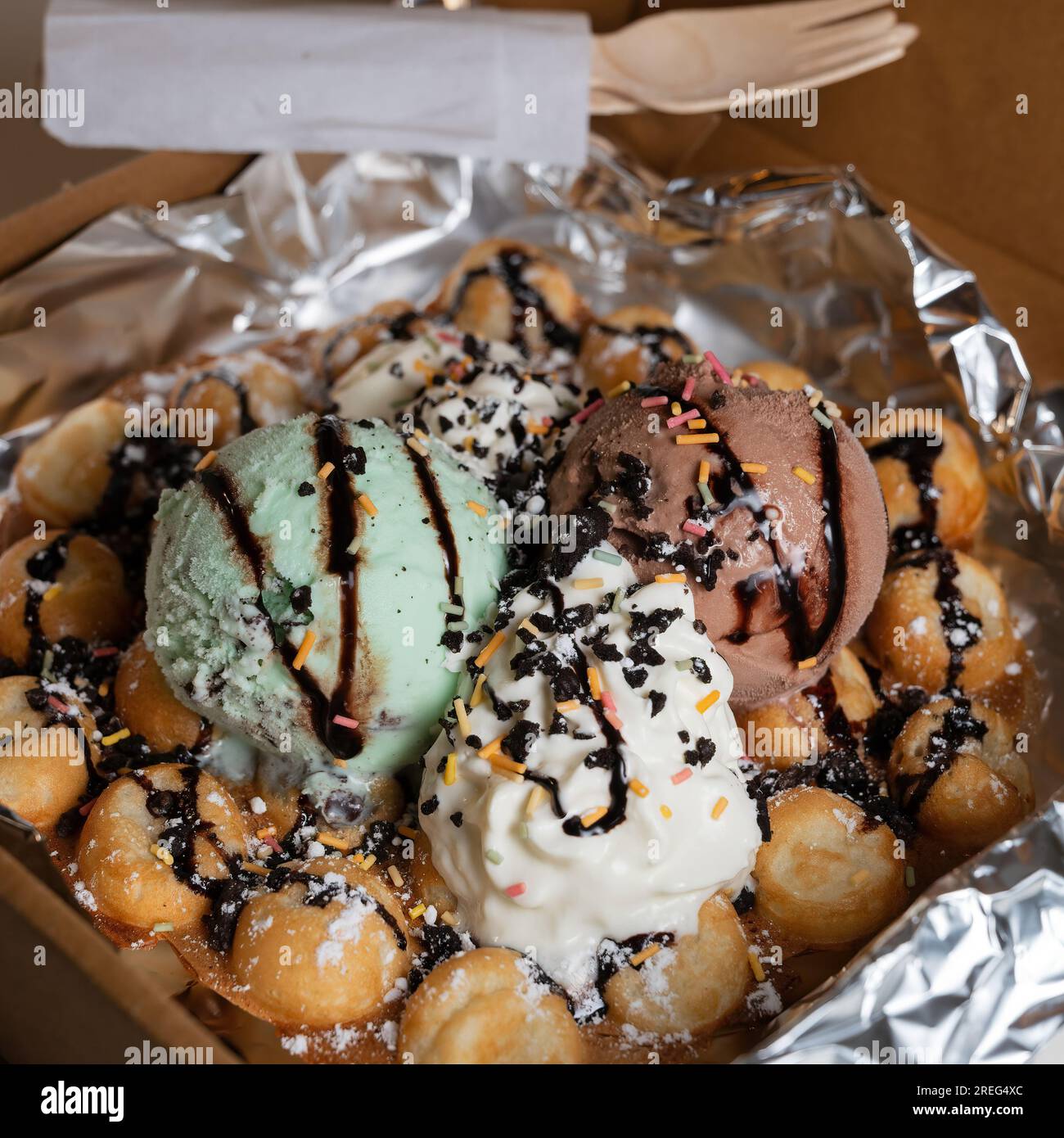 Bubble waffle topped with chocolate gelato and mint chocolate chip ...