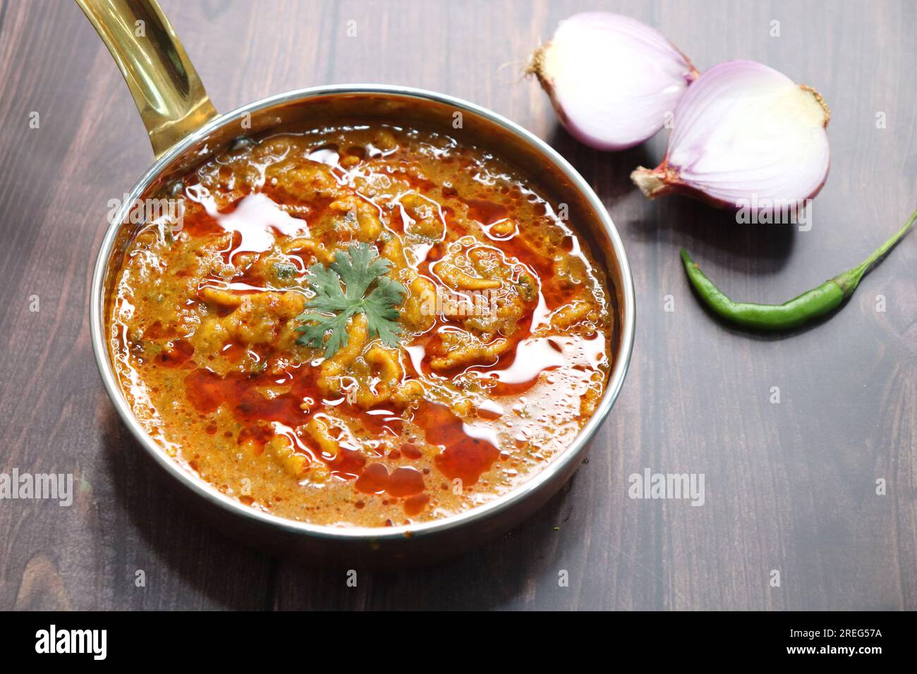 Traditional Sev bhaji or sev tamatar nu Shaak with Jowar Bhakri. Sev is ...
