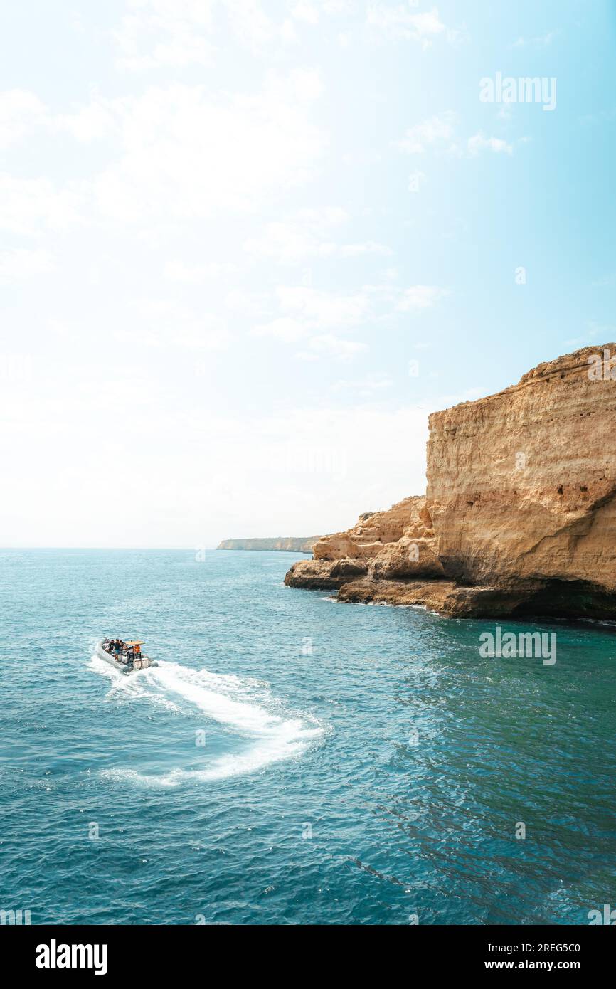 Tourist Boat exploring the Atlantic Ocean at Carvoeiro, Algarve ...