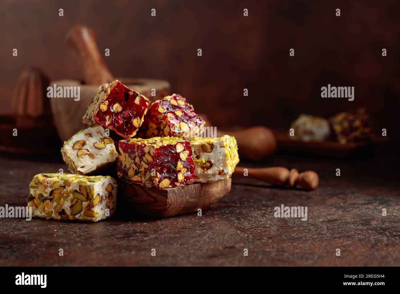 Traditional Turkish delight on an old brown table with wooden kitchen ...