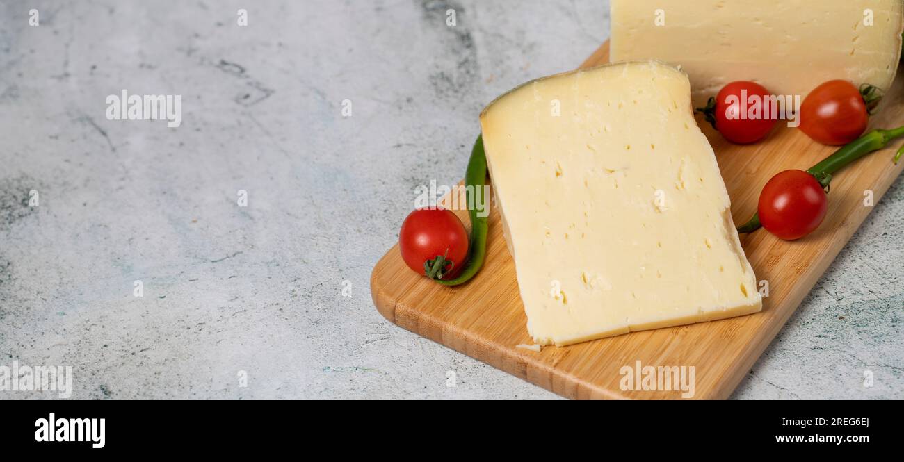 wheel cheese. Cheese made from cow's milk on a wooden flipchart ...