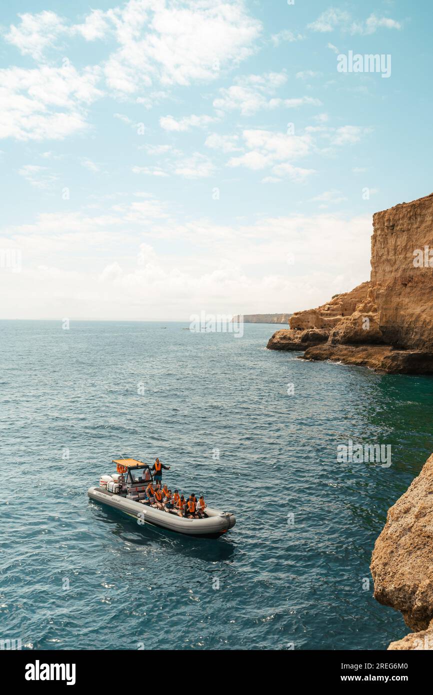 Tourist Boat exploring the Atlantic Ocean at Carvoeiro, Algarve ...
