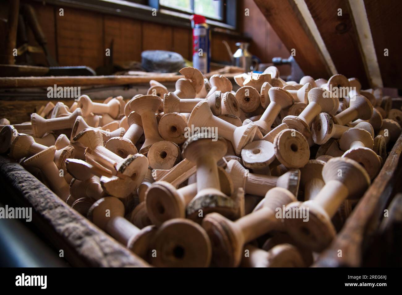 A collection of wooden bobbins on display at the Stott Park Bobbin Mill ...