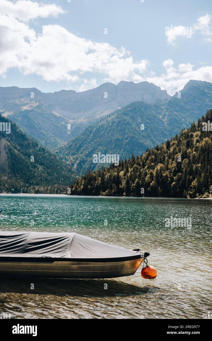 Boats at Lake Plansee, mountain lake in Austria close to Germany ...