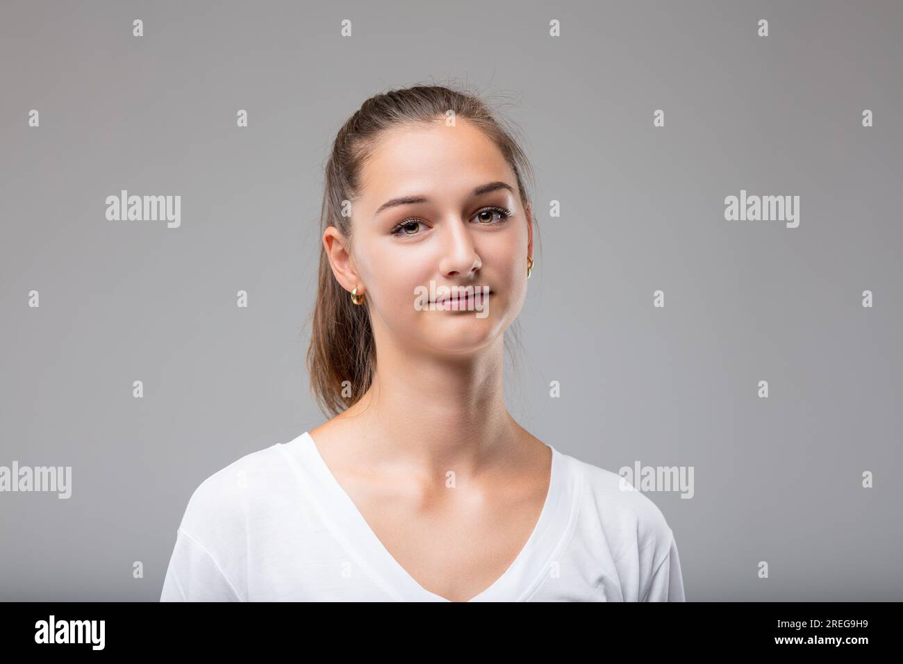 Inscrutable expression of apparent listening. The young woman could be ...