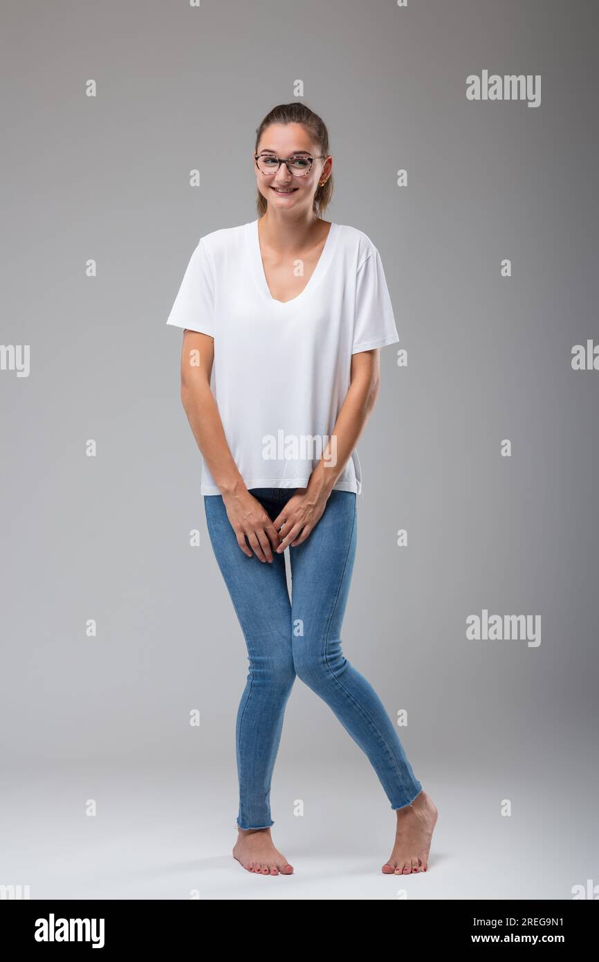 woman, legs crossed at the knees out of embarrassment and urgency ...