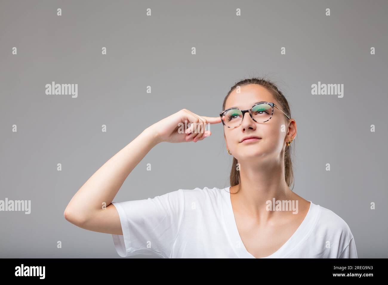 An intelligent, ingenious woman's face signals that she's made an ...